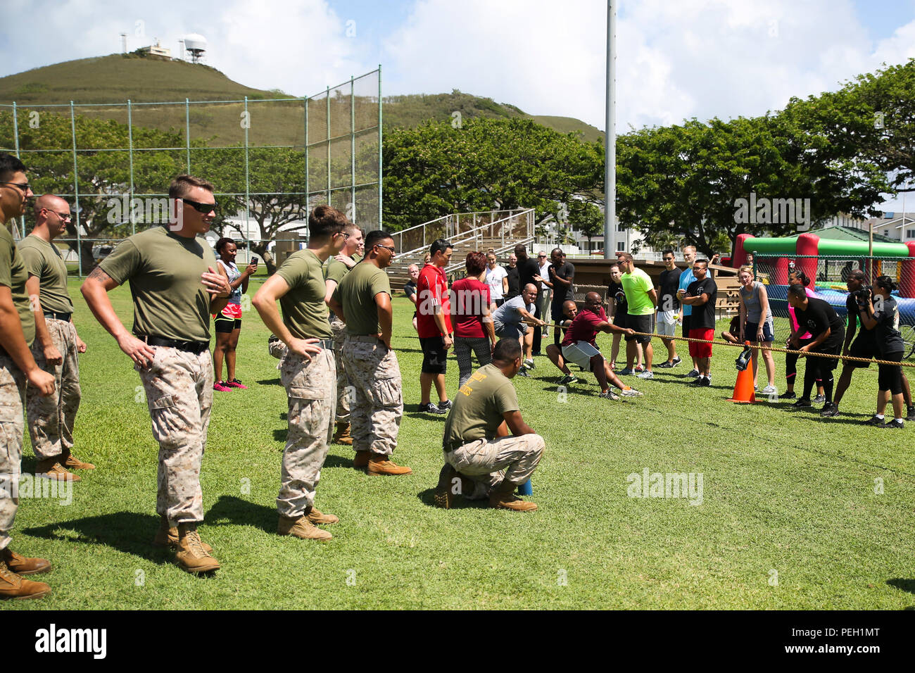 MARINE CORPS BASE HAWAII — Service members gather and observe a game of ...