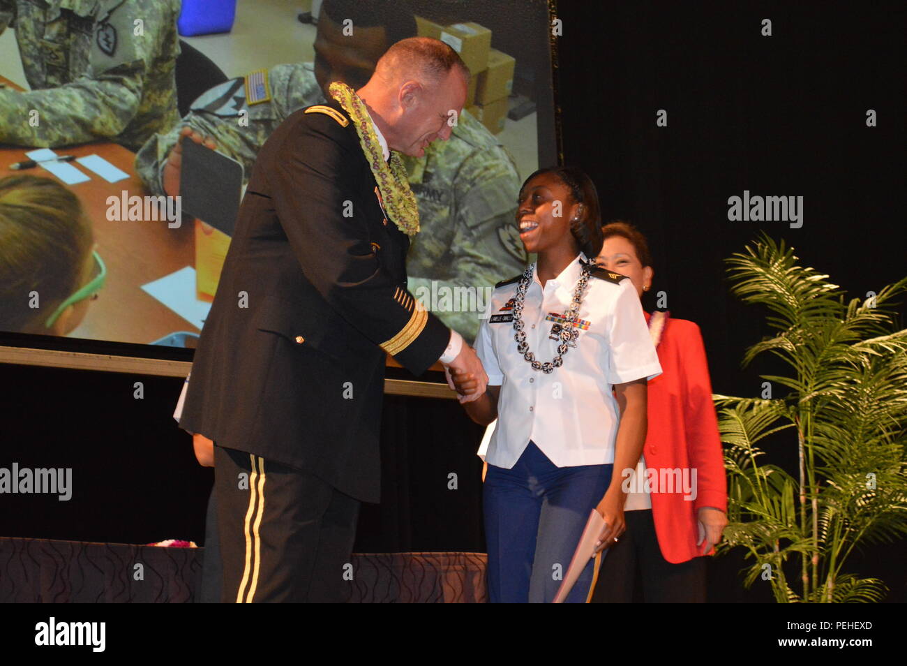 Sgt. Porsha Lamelle-Smalls shakes the hand of Maj. Gen. Eric P. Wendt ...