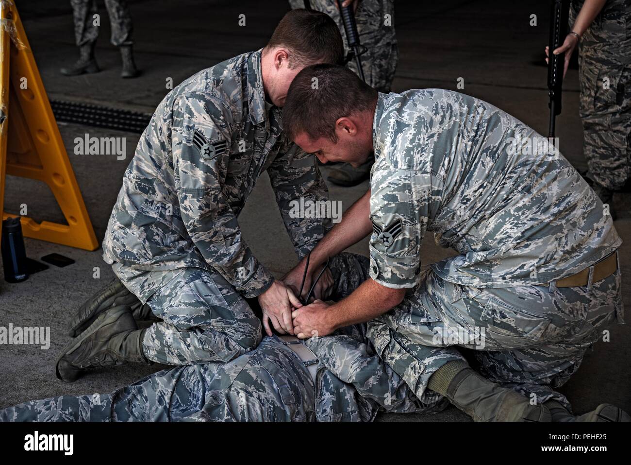 Senior Airmen Cody Murphy and William Garrett, 51st Medical Group ...