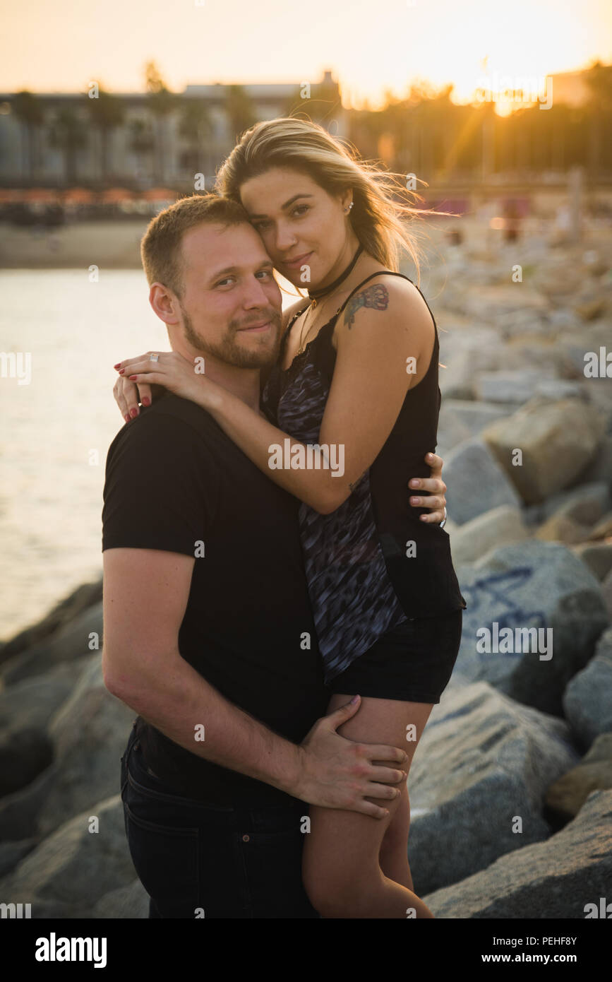 Romantic Couple Holding Each Other By The Sea In Barcelona Love And
