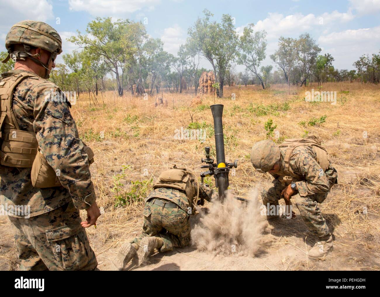 U.S. Marines fire an 81mm mortar round Aug. 21 at Mount Bundey Training ...