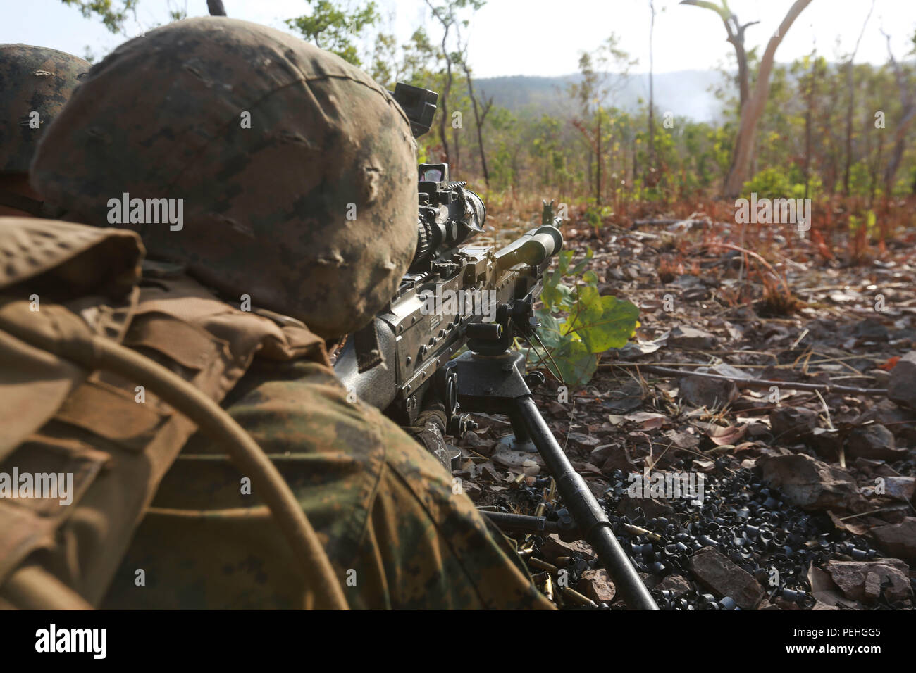 U.S. Marine Corps Lance Cpl. Noah Soliz fires his M240-B medium machine ...