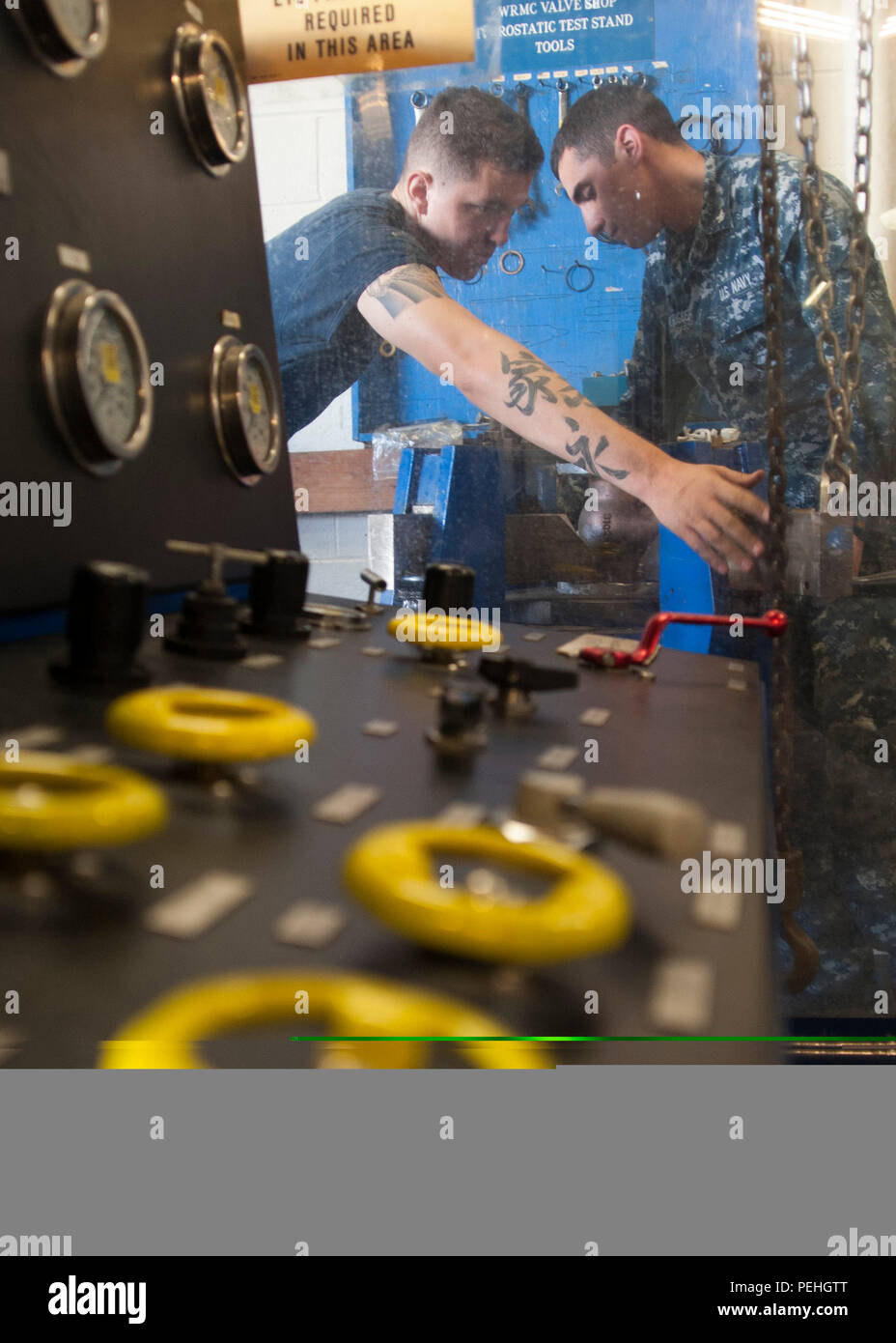 SAN DIEGO (Aug. 19, 2015) Machinist's Mate Fireman Eric Jobe, left, and ...