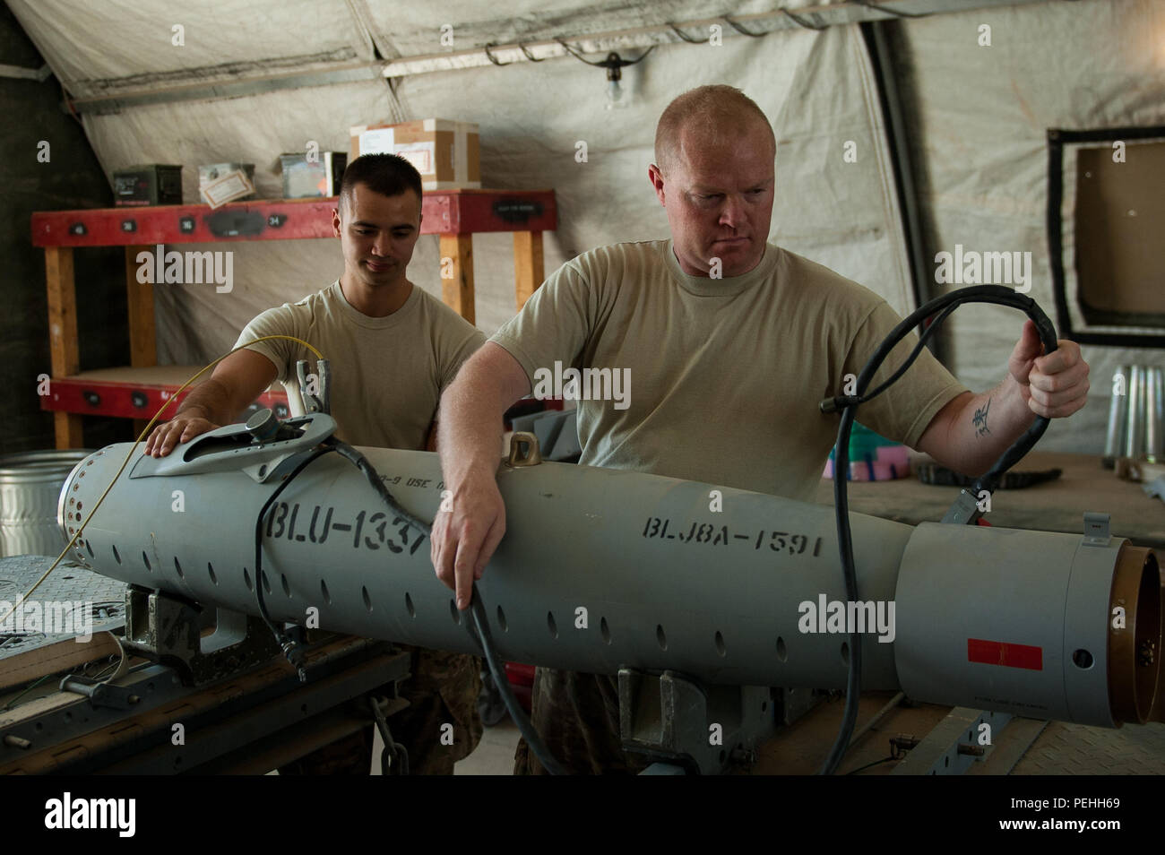 U.S. Air Force Airman 1st Class Matthew Lopez, left, 62nd Expeditionary ...