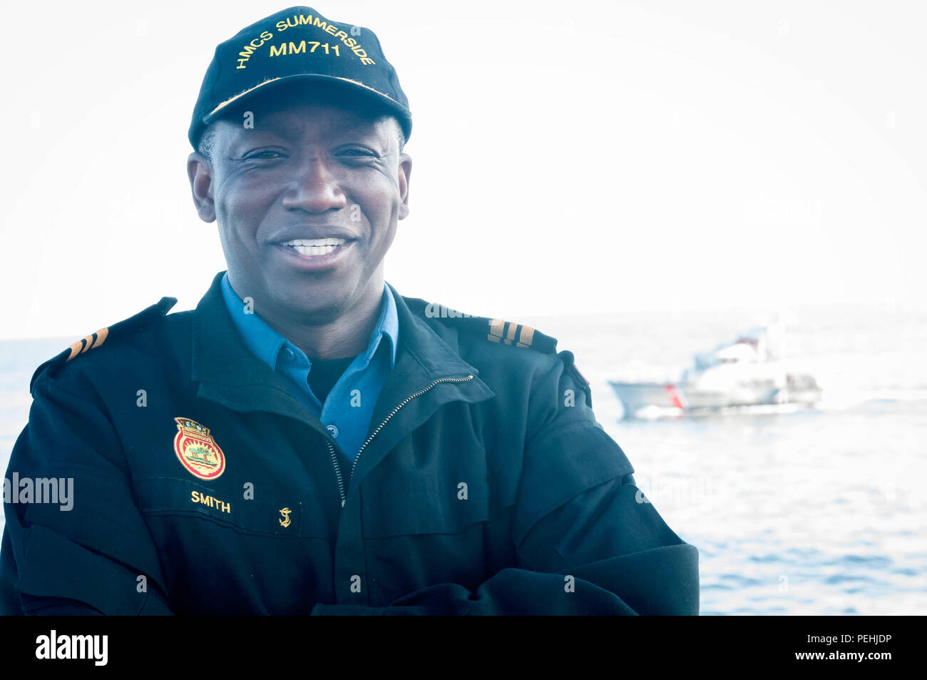 A helicopter rescue crew from Air Station Cape Cod in Bourne, Mass ...