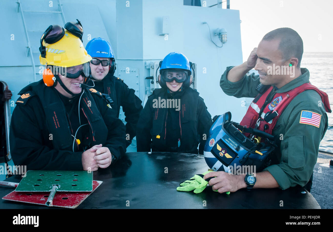 A helicopter rescue crew from Air Station Cape Cod in Bourne, Mass ...