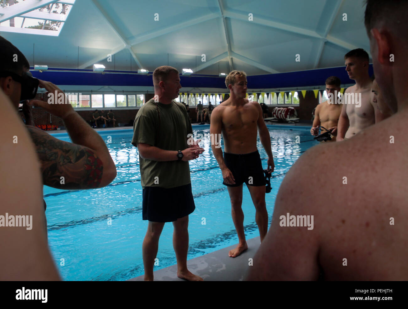 A Marine with 2nd Reconnaissance Battalion speaks with the students ...
