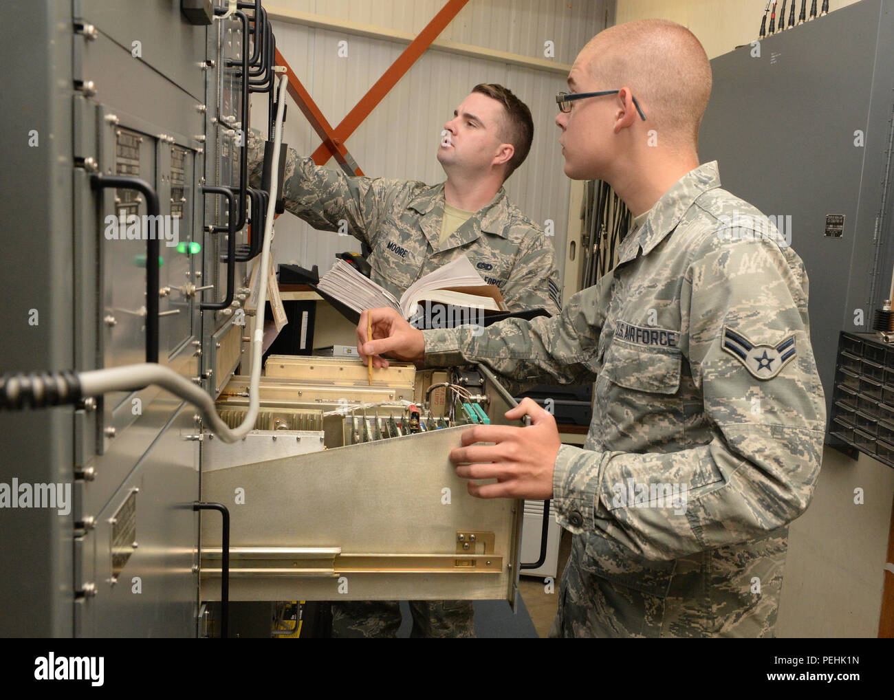 U.S. Air Force Staff Sgt. Matthew Moore and Airman 1st Class Nathanniel ...