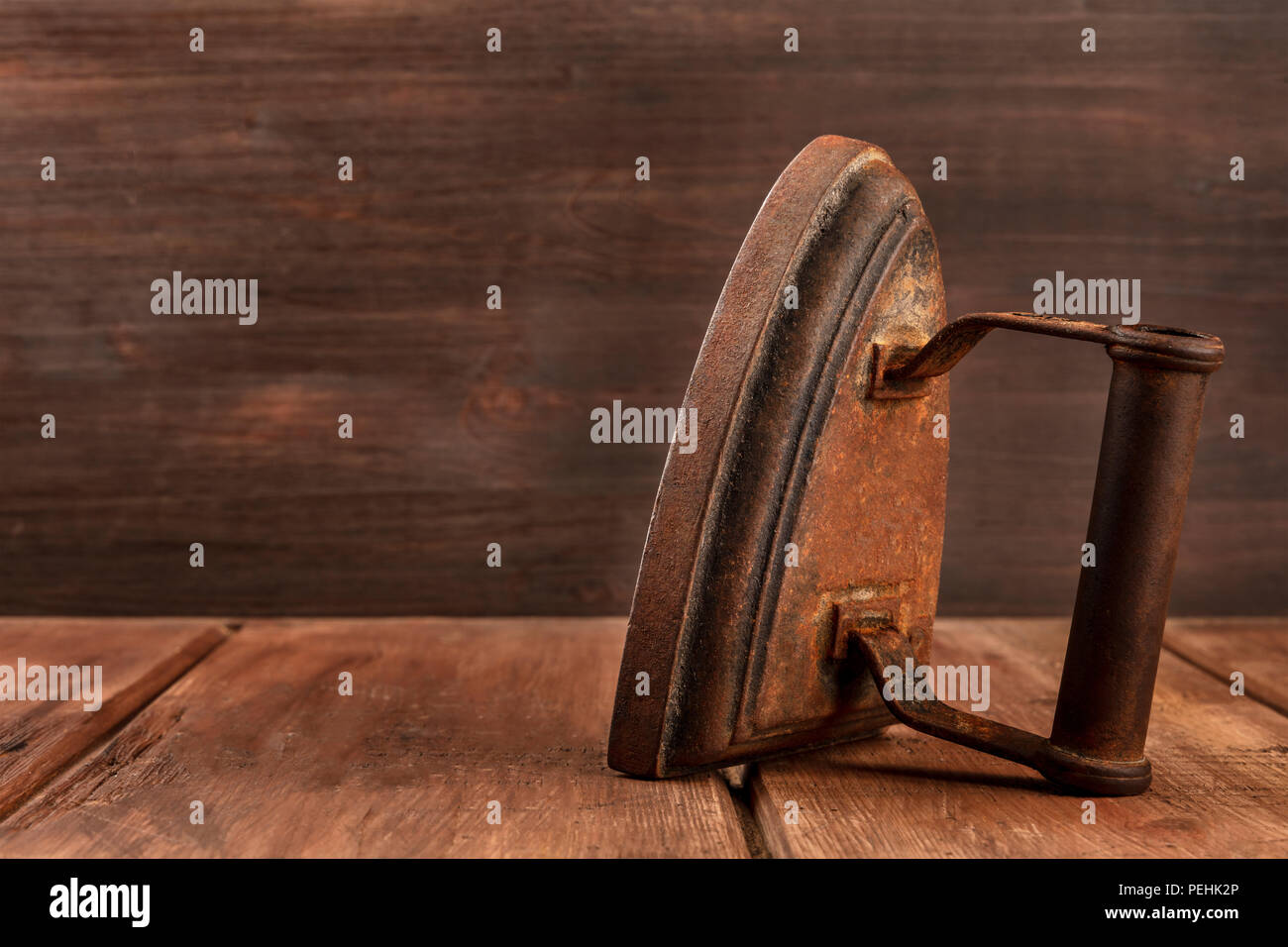 Side view of a vintage iron on a dark background with copy space Stock ...