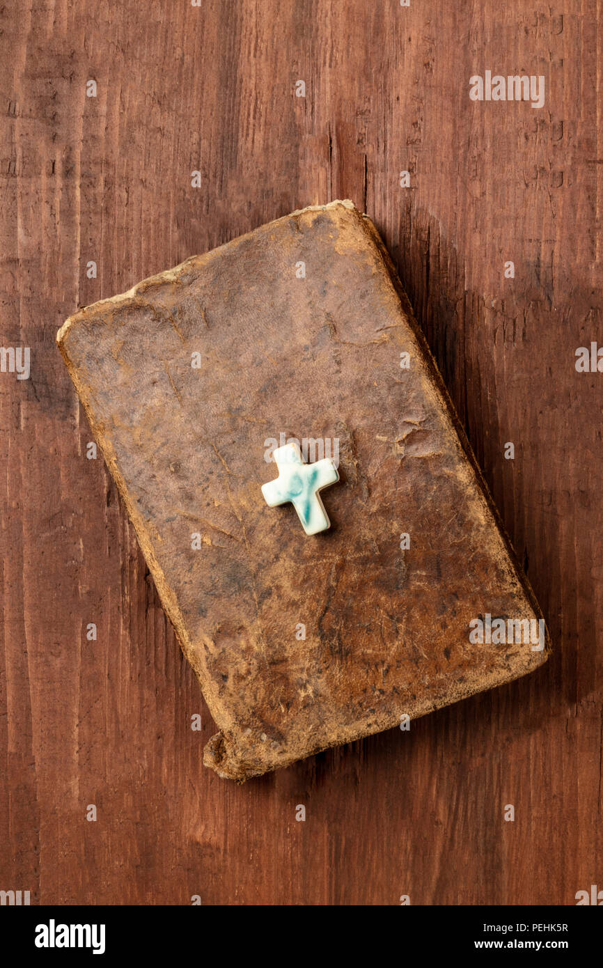 Old bible with a cross on a dark texture with copy space Stock Photo ...