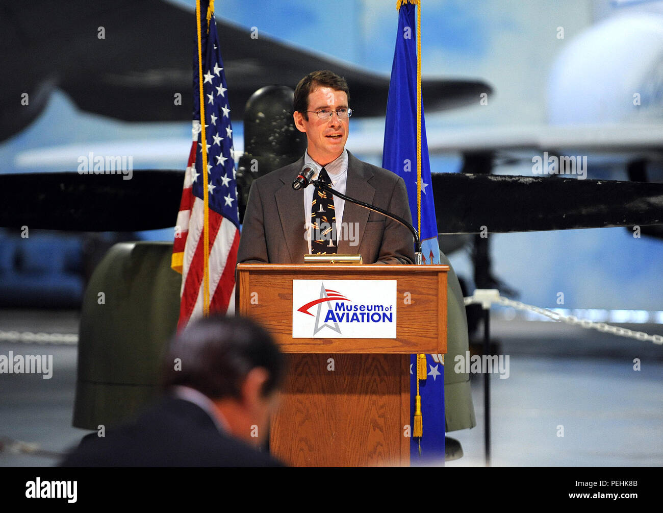Mike Rowland, Museum of Aviation curator, addresses an audience during ...