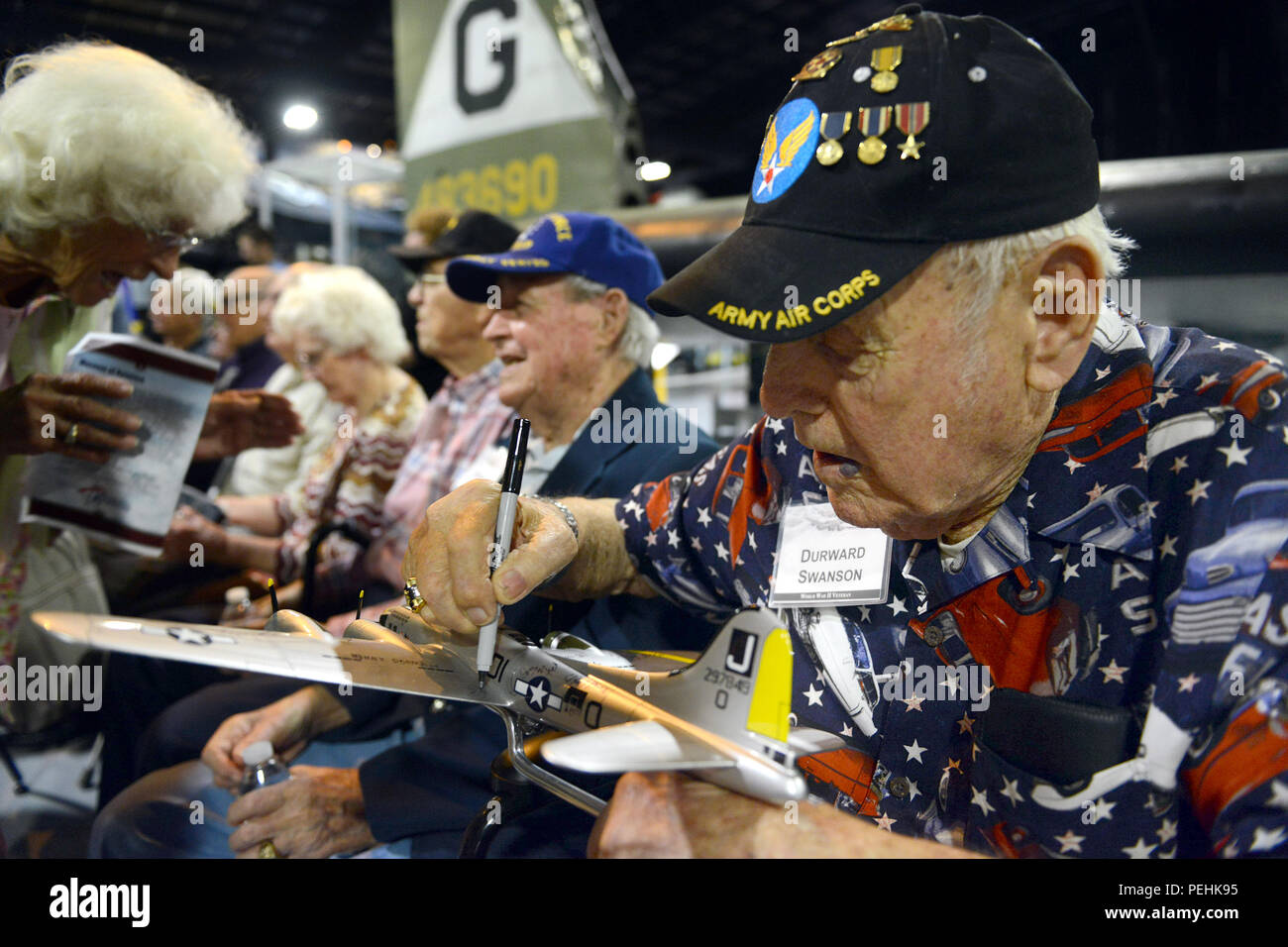 Durward Swanson, Army Air Force veteran, autographs a B-17 model ...