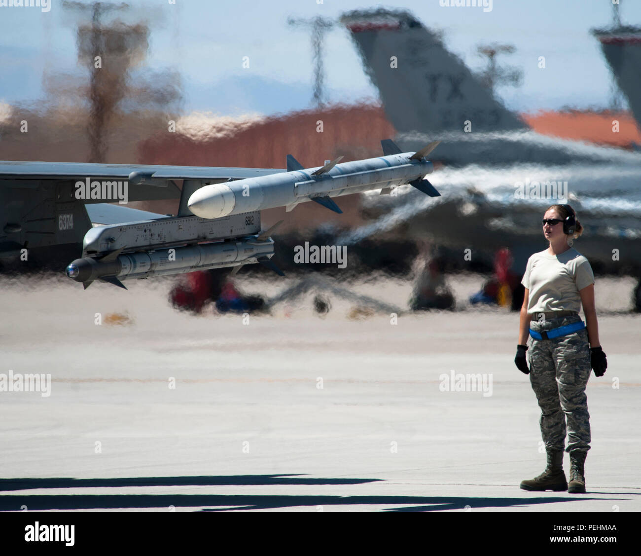 An F-16 Fighting Falcon maintainer completes a final pre-flight ...