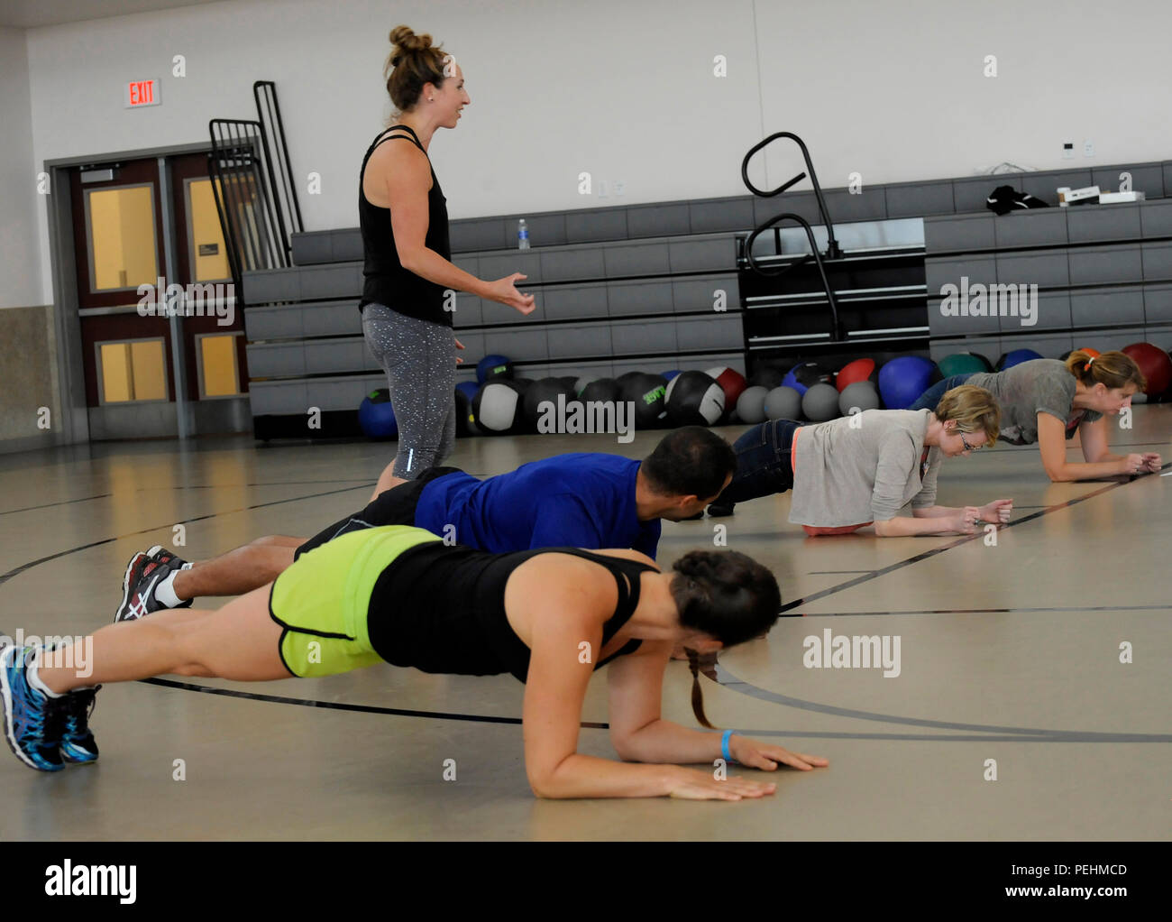 Sara Coleman leads a CrossFit class for parents during the Back2School ...