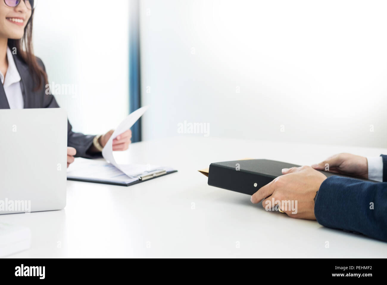 Female Manager conducting a job interview with female applicant looking ...