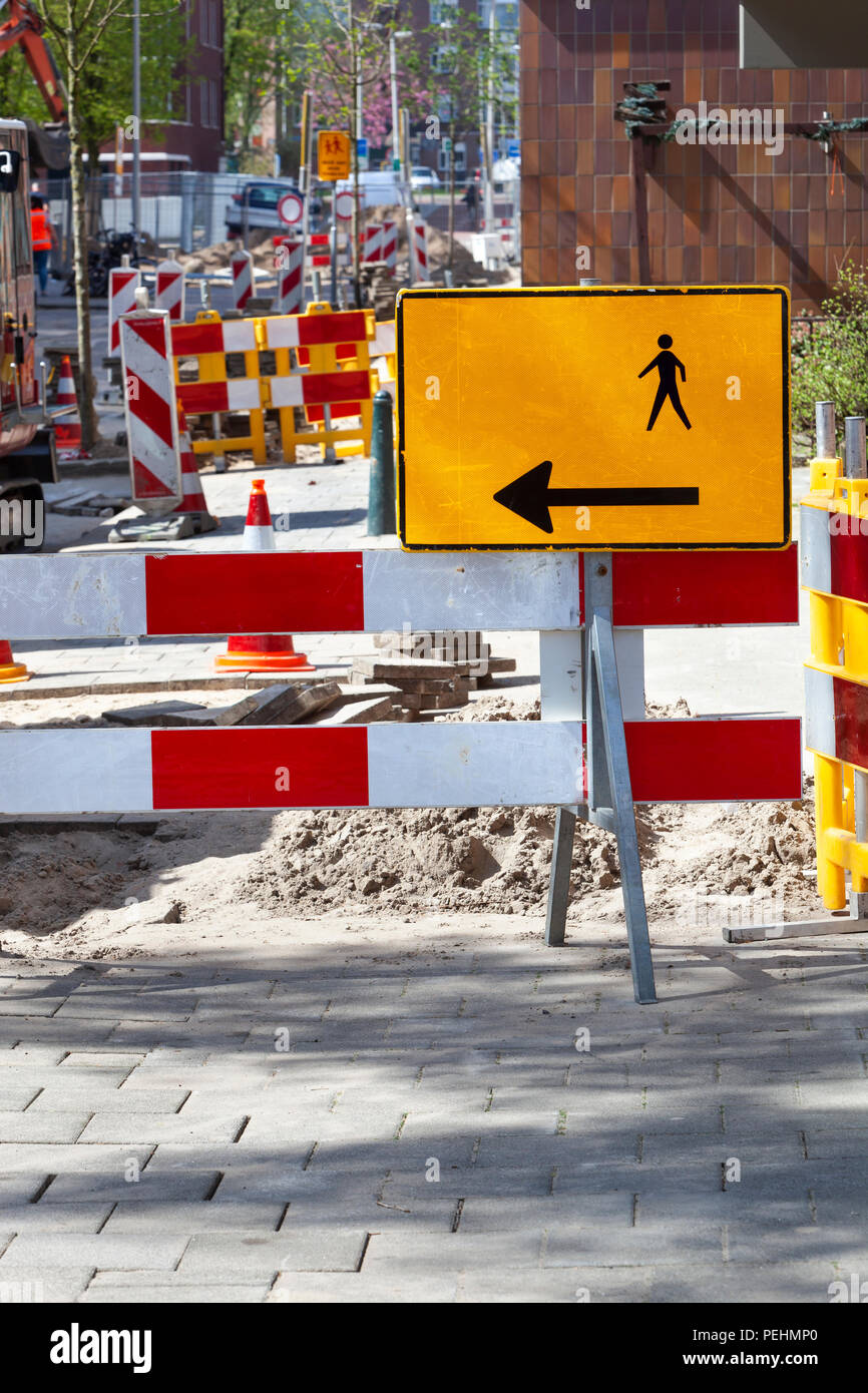 Footpath reconstruction with barriers and signs in the Netherlands ...