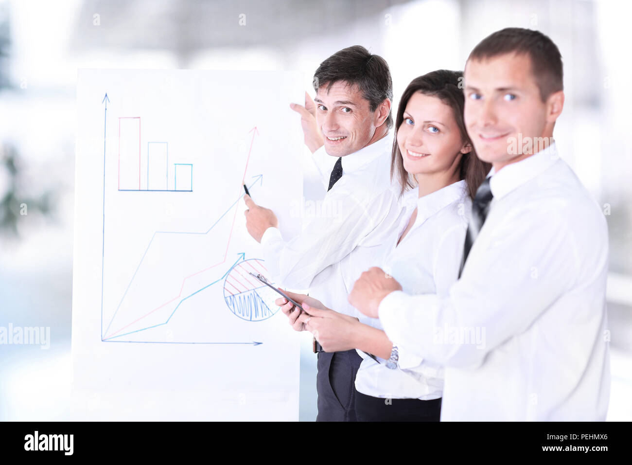 Business team discussing a project and sales growth in the office Stock ...