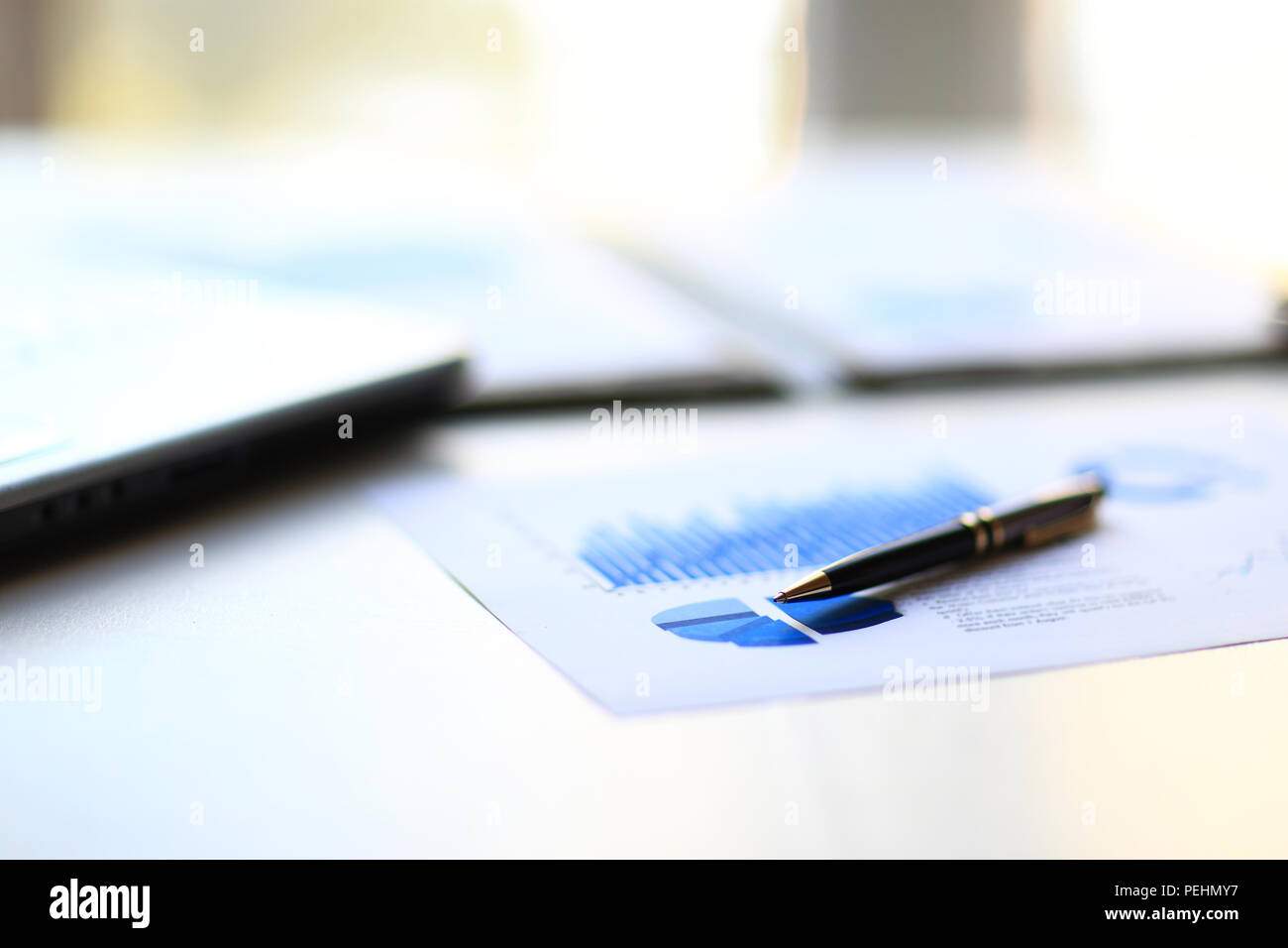 Financial management graphs in a corporate blue color Stock Photo - Alamy