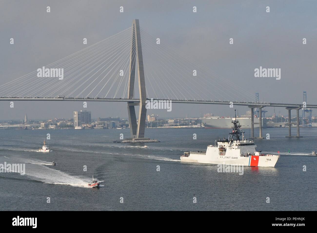 The U.S. Coast Guard Cutter James transits past the Ravenel Bridge in ...