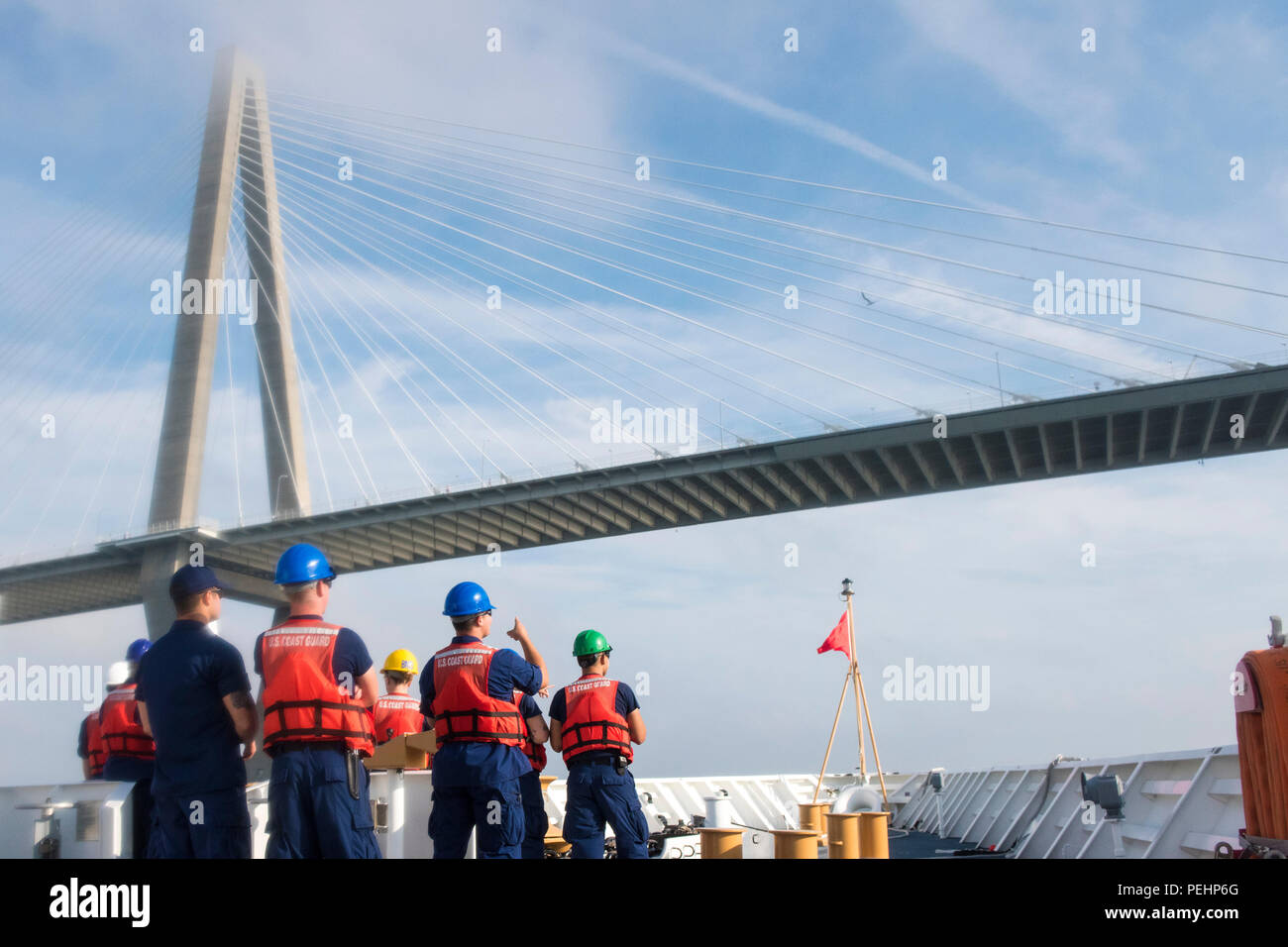 The crew of Coast Guard Cutter James admire the Ravanel Bridge as they ...
