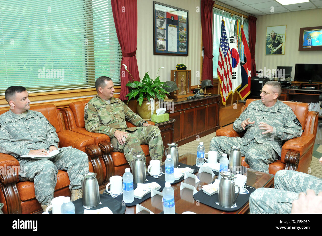 Brig. Gen. William E. King IV (center), the commanding general of 20th CBRNE Command, meets with ...