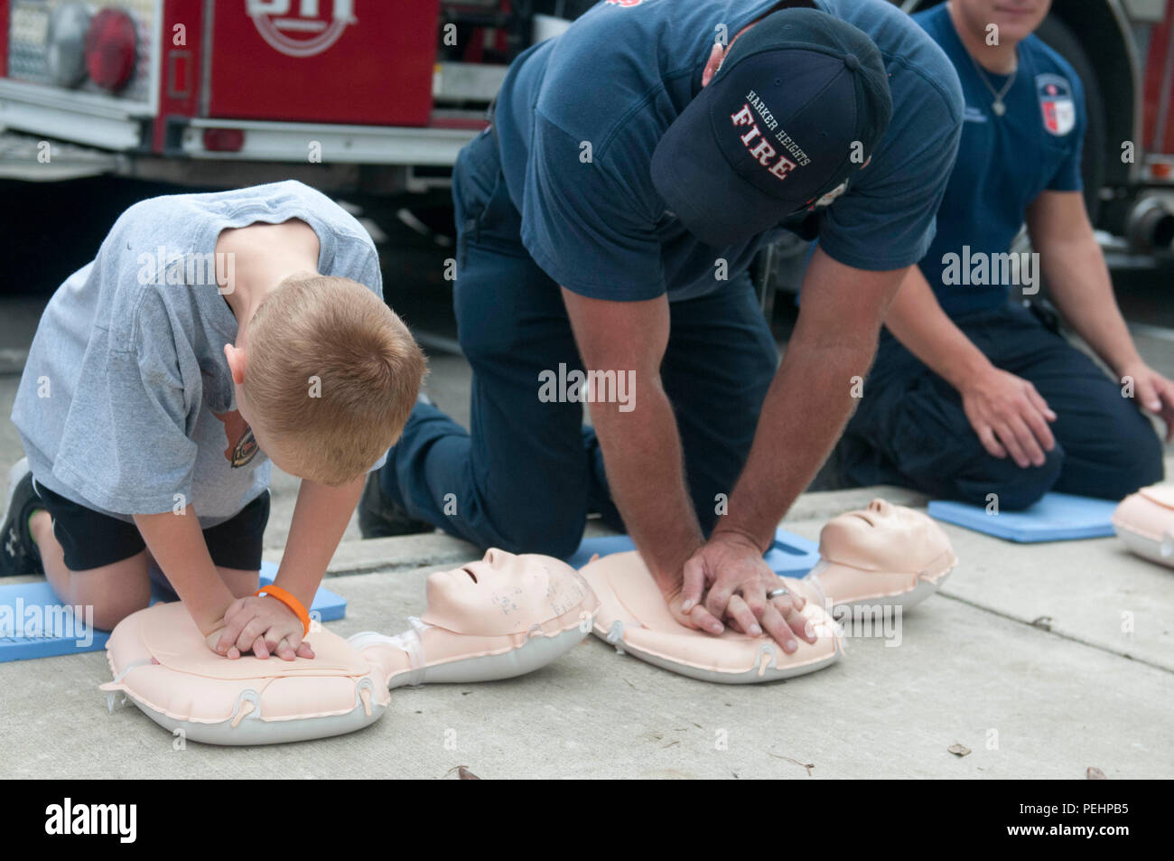 Devin Pitrucha, 7, learns how to give CPR from Anthony Combs ...