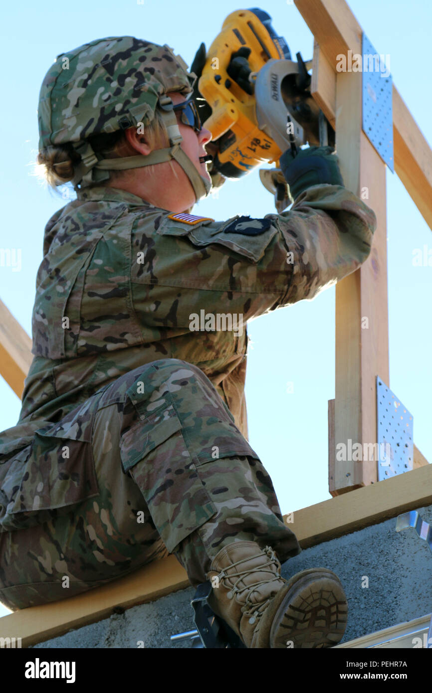 Spc. Beth Durr, a carpenter with the 166th Engineer Company, squares ...