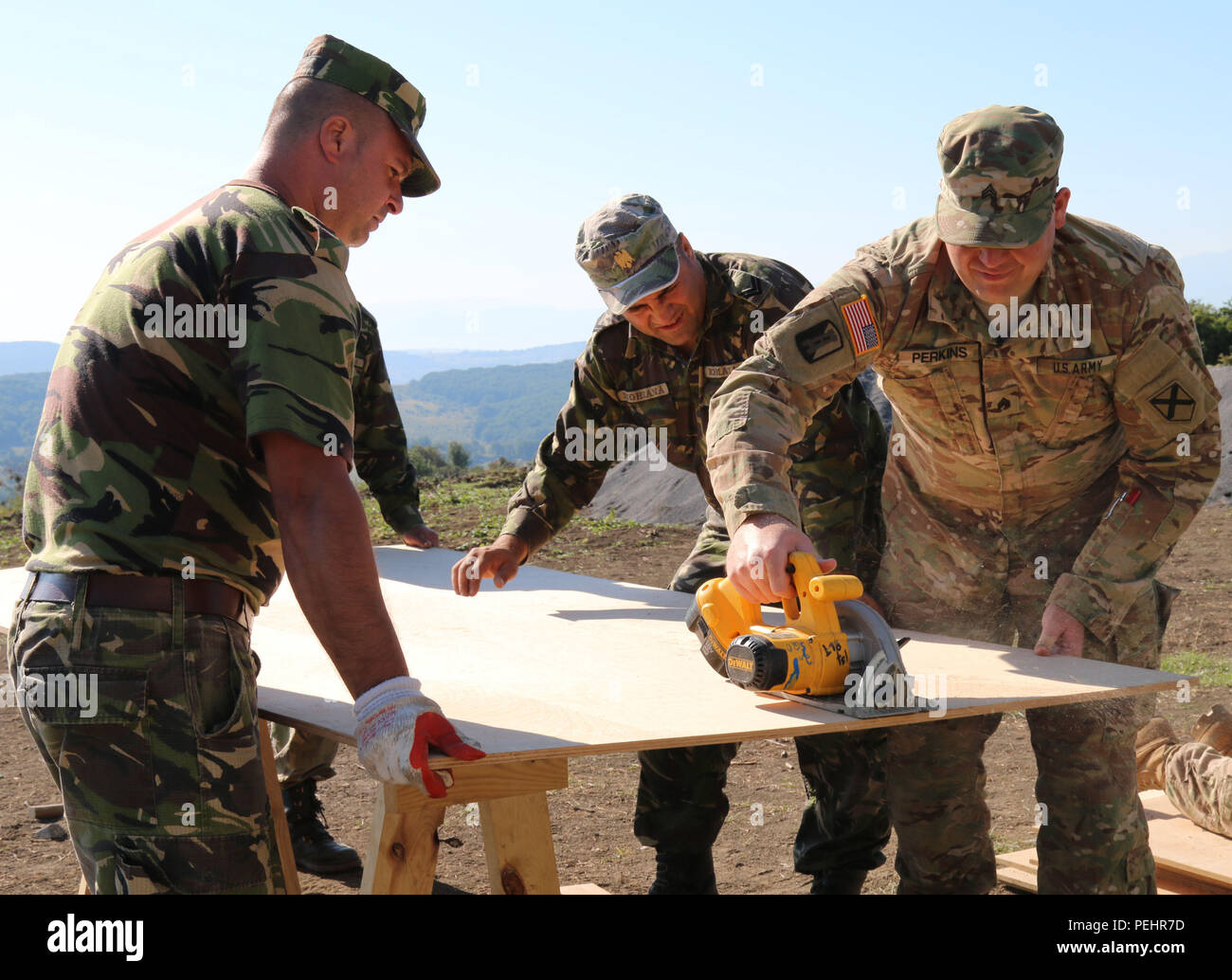 Cpl. Gica Gorgan and Cpl. Claudiu Dugheana with the Romanian armed ...