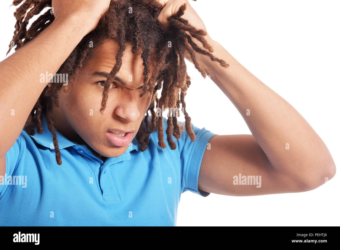 angry young man posing against white background Stock Photo - Alamy