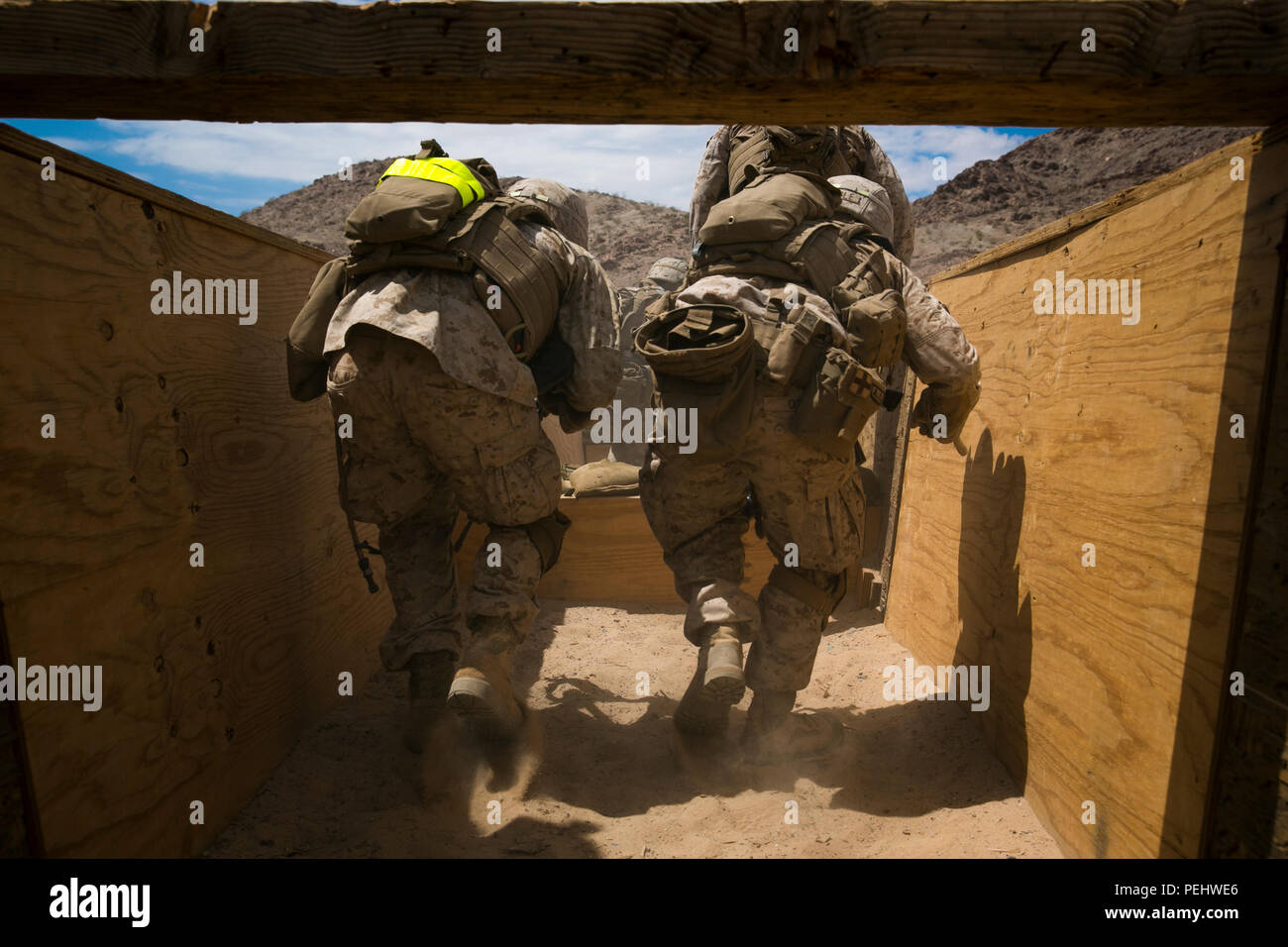 Marines with Company E, 2nd Battalion, 7th Marine Regiment, assault a ...