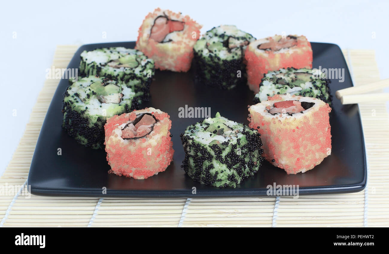 Sushi Set - different types of Maki sushi and chopsticks on a b Stock ...