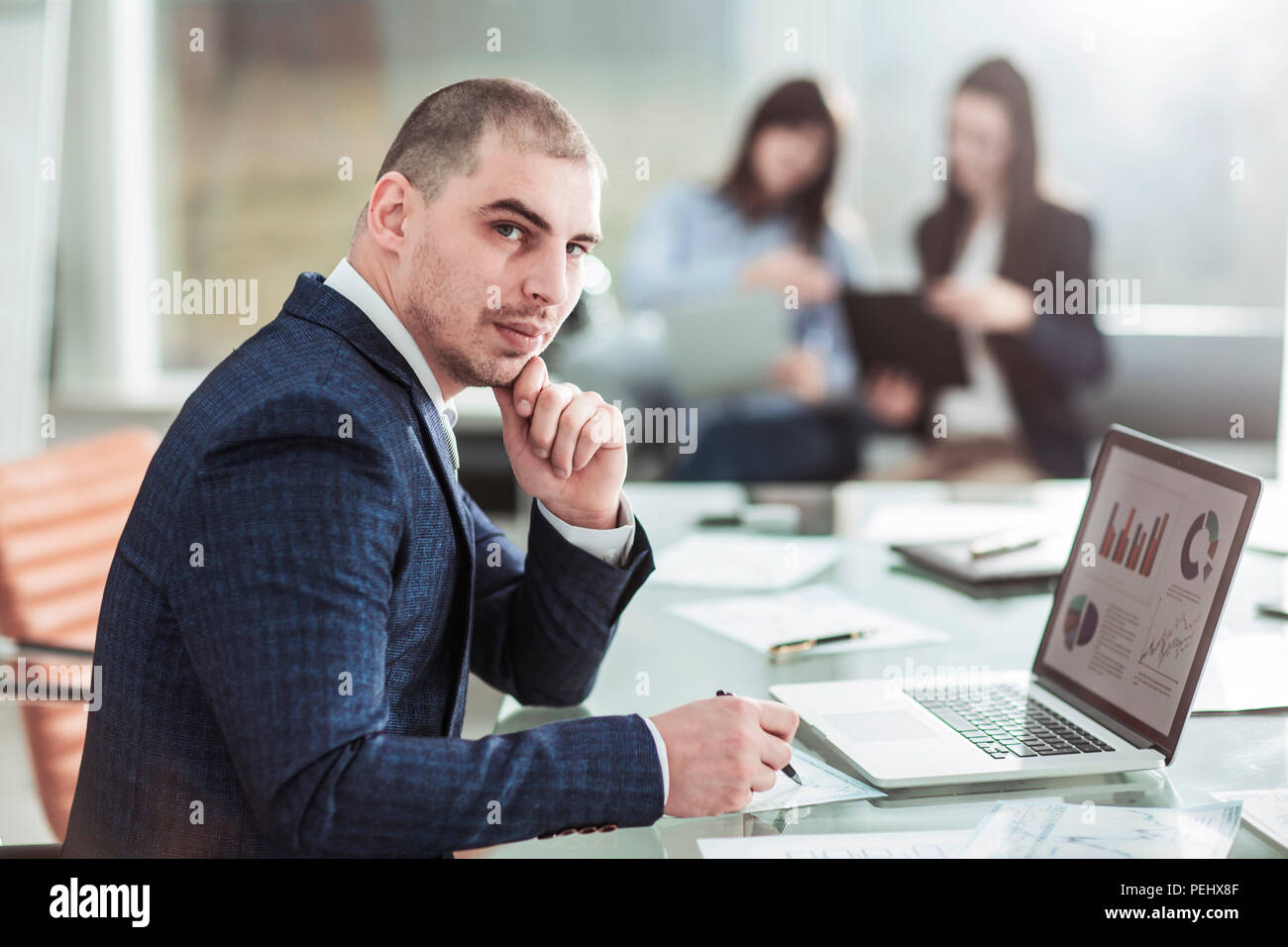 senior Manager at the workplace on the background of business team ...