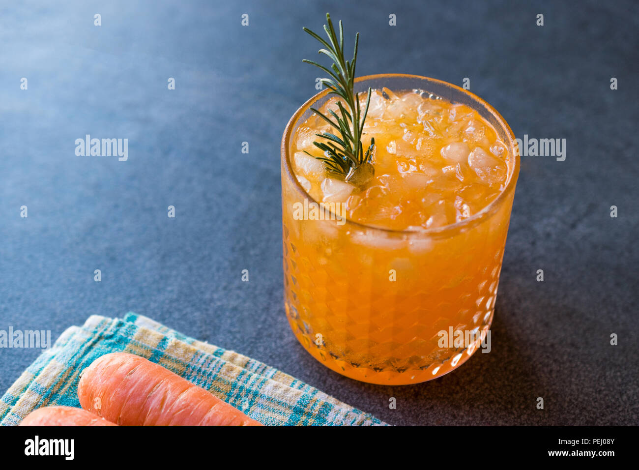Carrot Cocktail with Crushed Ice and Rosemary. Beverage Concept Stock ...