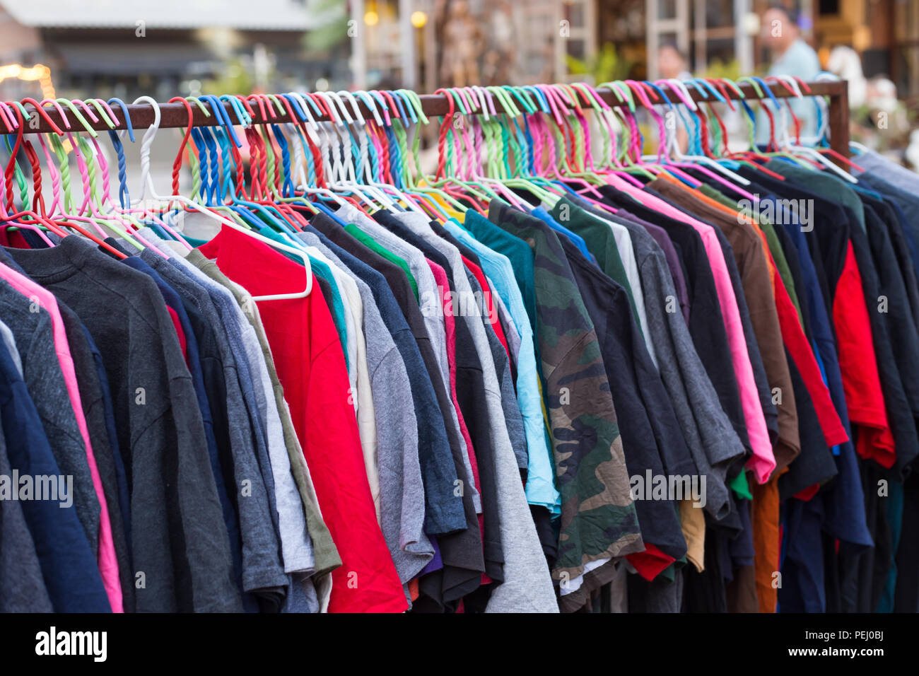 Various color of T-shirt on rack Stock Photo - Alamy