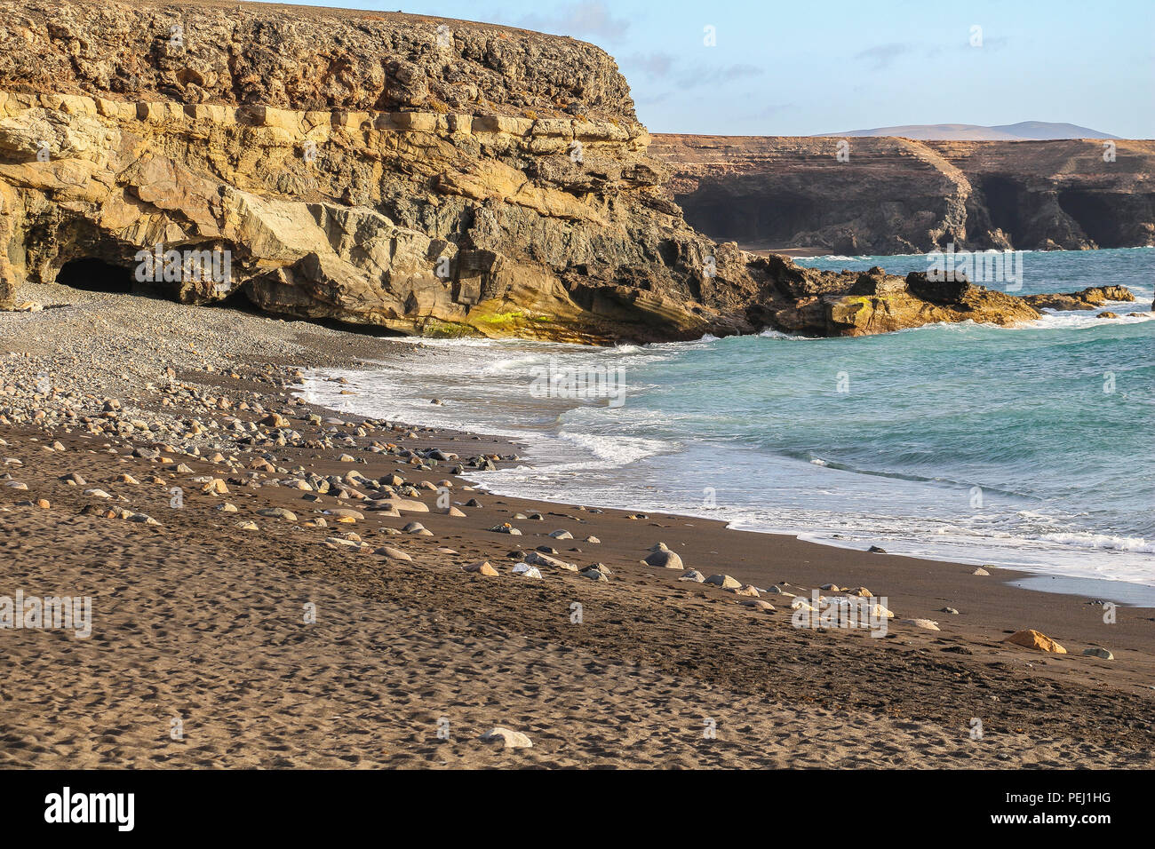 Playa de los Muerto black beach at sunset, Fuerteventura Stock Photo ...