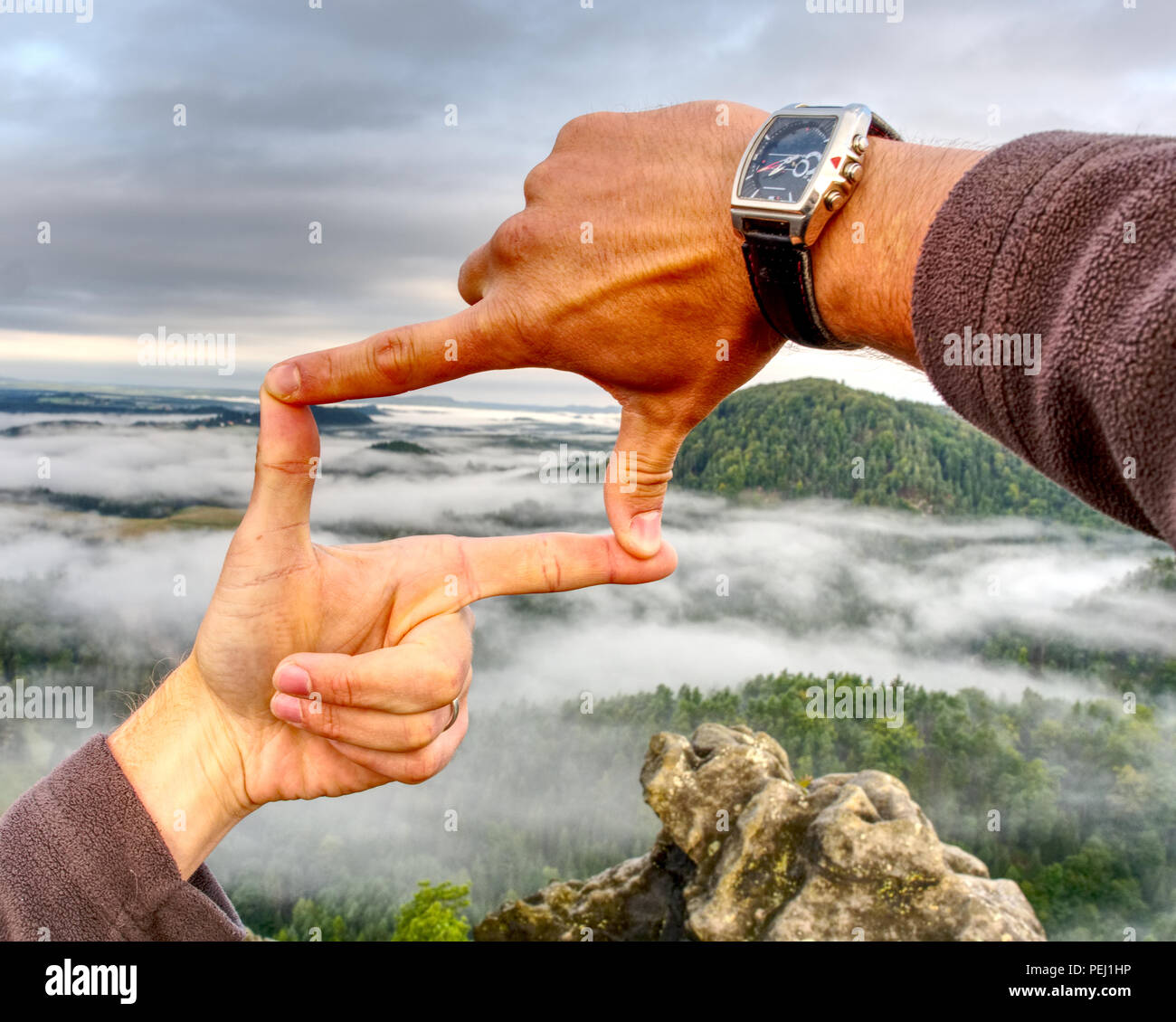 Frame made of hands and nature landscape. Palms with fingers making a ...
