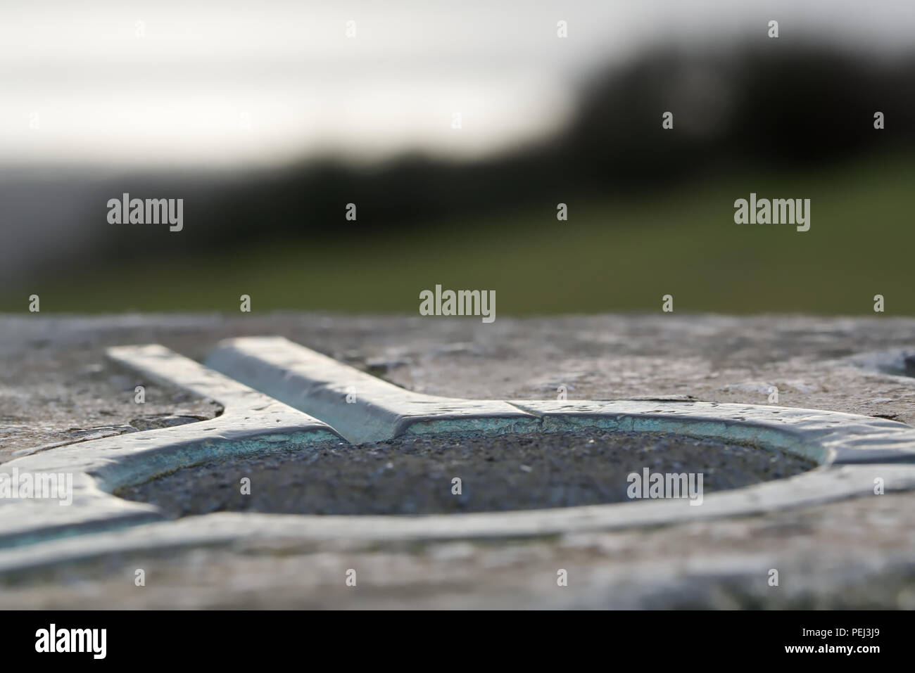 Trig point at Sand Point, Somerset, with out of focus background ...