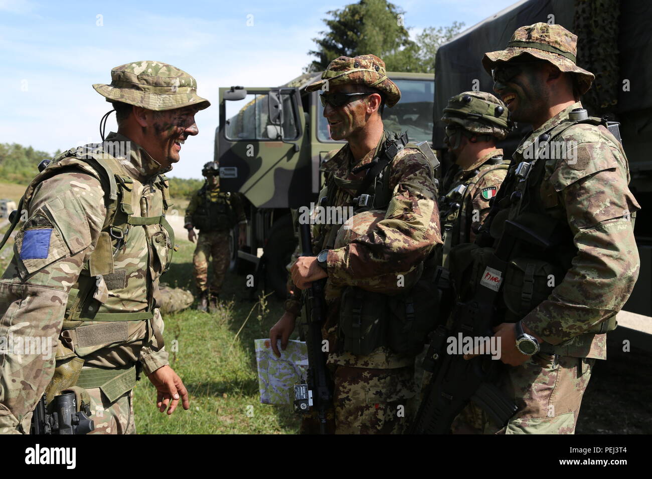 British and Italian soldiers discuss mission objectives during exercise ...