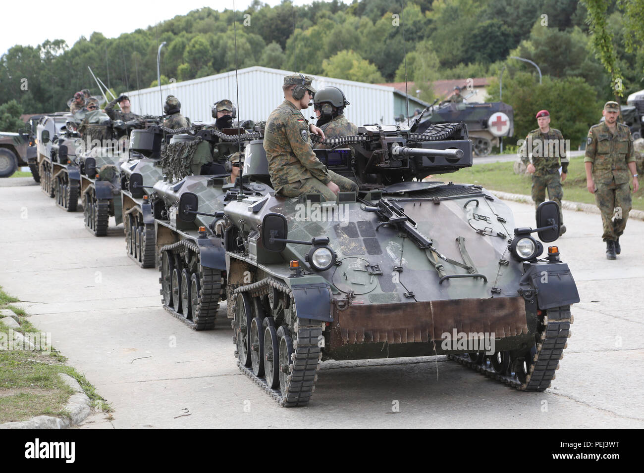 German soldiers of the 37th Mechanized Infantry Brigade line up Wiesel ...
