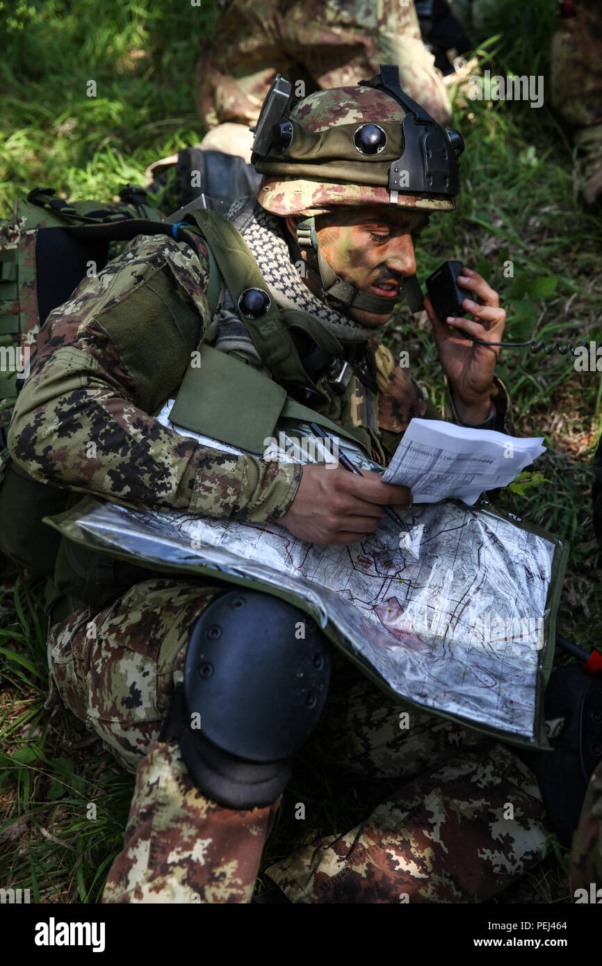 An Italian soldier of the 183rd Parachute Regiment communicates his ...