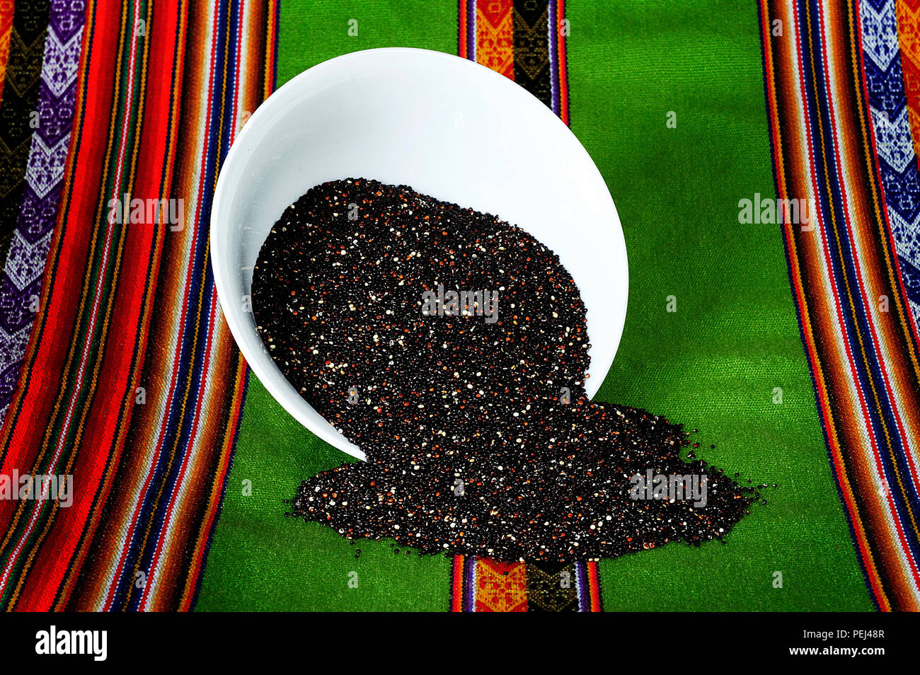 Black Quinoa grain. Black quinoa grain. in a white plate on an Inca ...