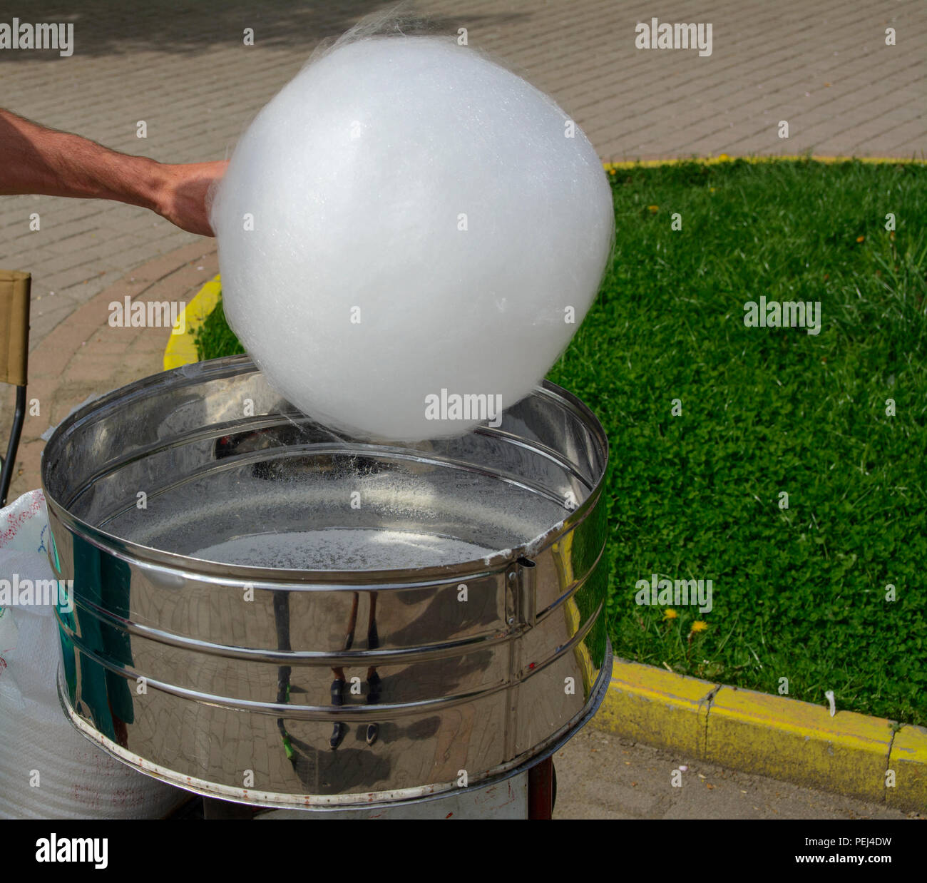 Machine for making sweet wool, production. Sweet white cotton wool on a ...