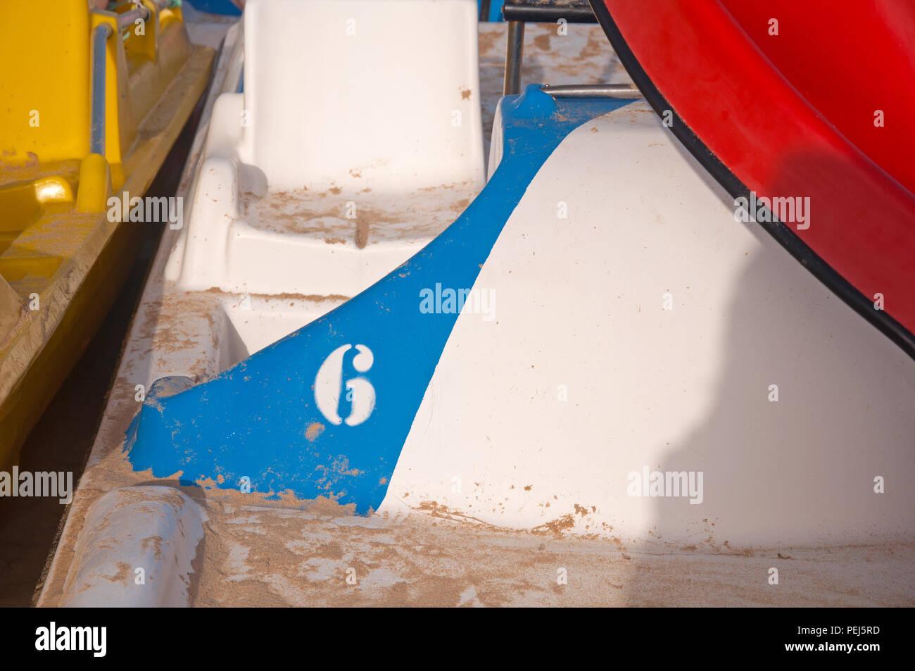 White number six in the side of the pleasure boat, seashore, summer ...