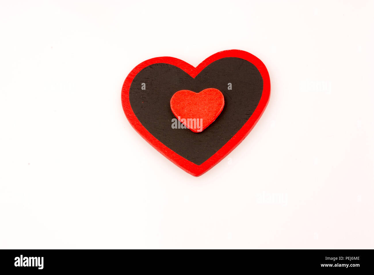 Heart inside a heart on a white background Stock Photo - Alamy