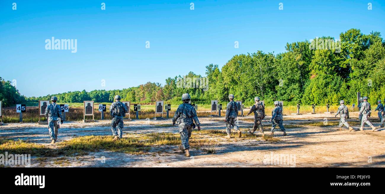 Army Public Health Center soldiers head toward their targets at an ...