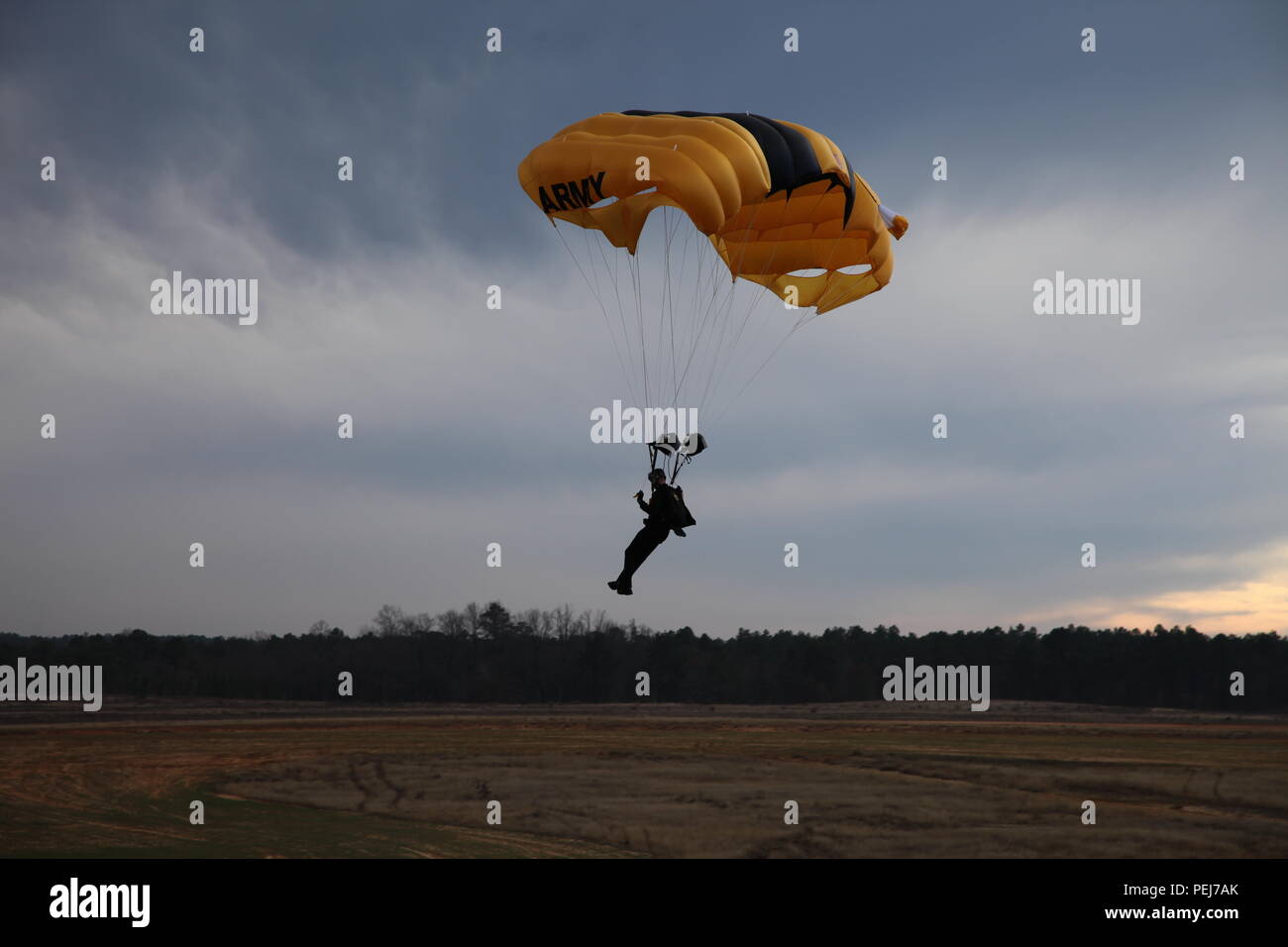 A U.S. Army paratrooper prepares to land on Luzon Drop Zone during an ...