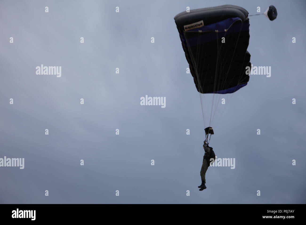 A U.S. Army paratrooper prepares to land on Luzon Drop Zone during an ...