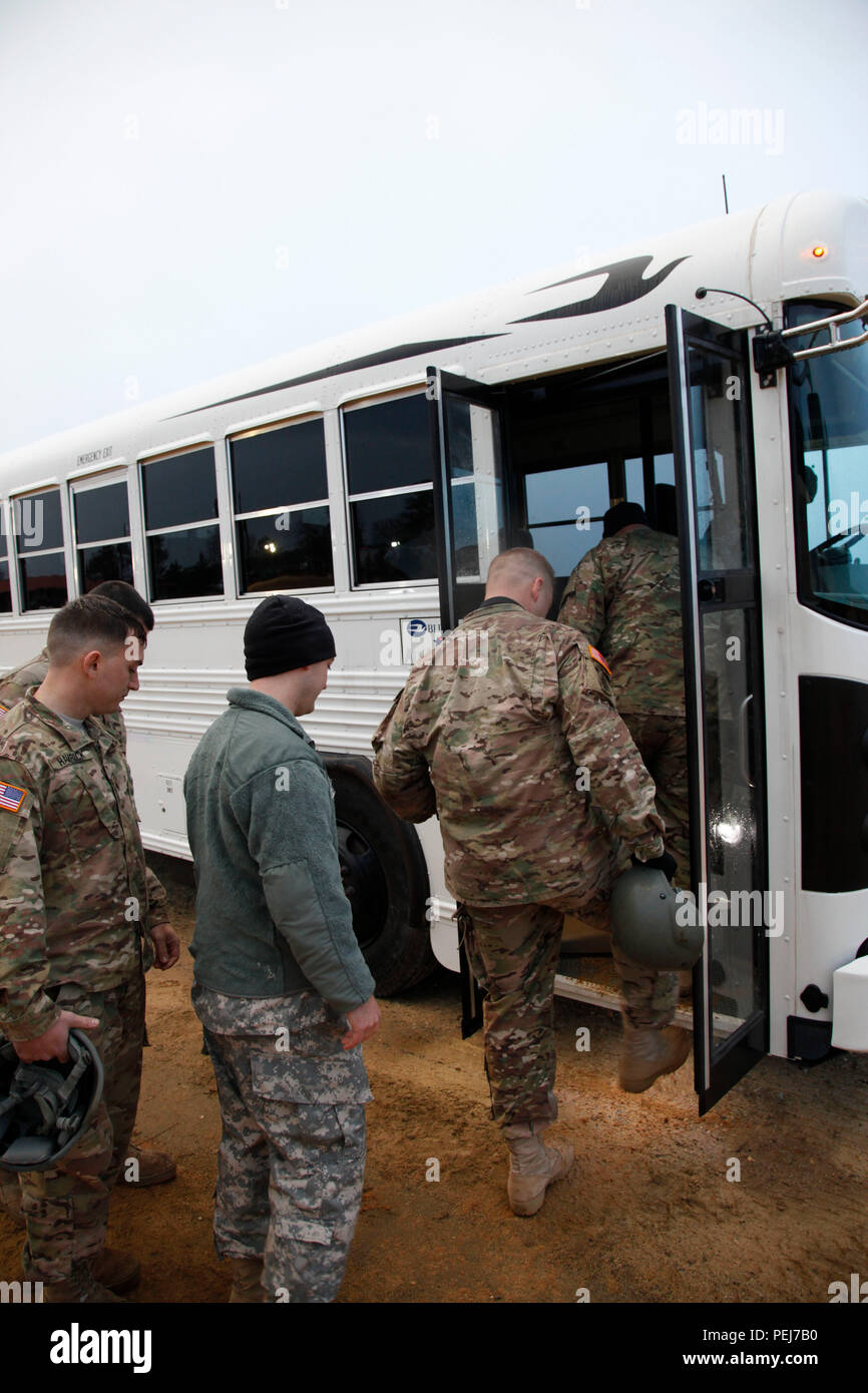 U.S. Army paratroopers load the bus on Luzon Drop Zone headed to ...
