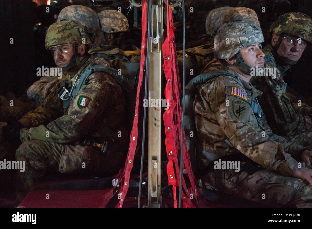 U.S. and Italian paratroopers wait to jump from a C-130 during an ...