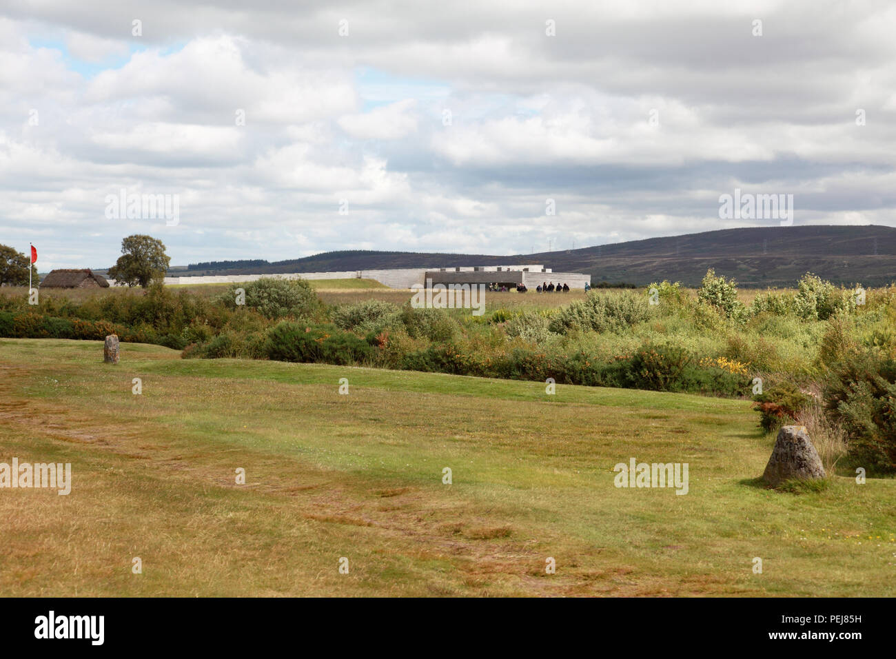 The visitor centre at Culloden, with clan headstones in the foreground ...